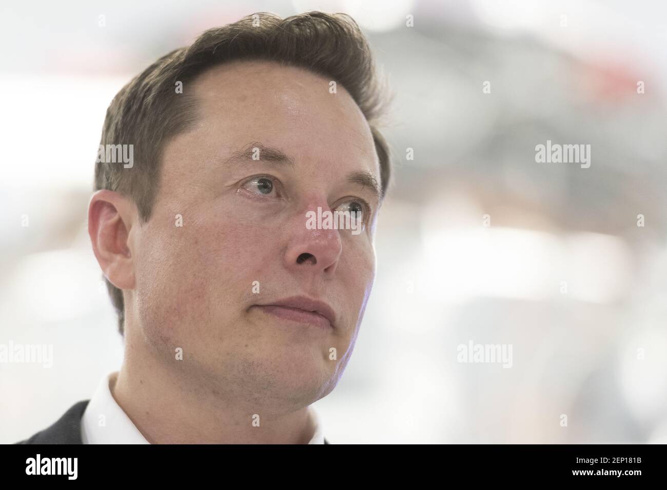 SpaceX Chief Engineer Elon Musk speaks to media in front of Crew Dragon ...