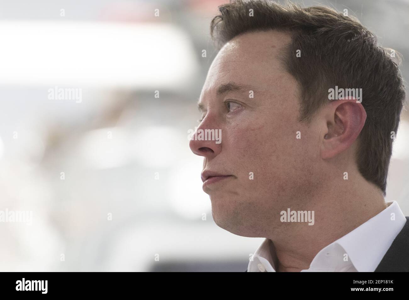 SpaceX Chief Engineer Elon Musk speaks to media in front of Crew Dragon ...