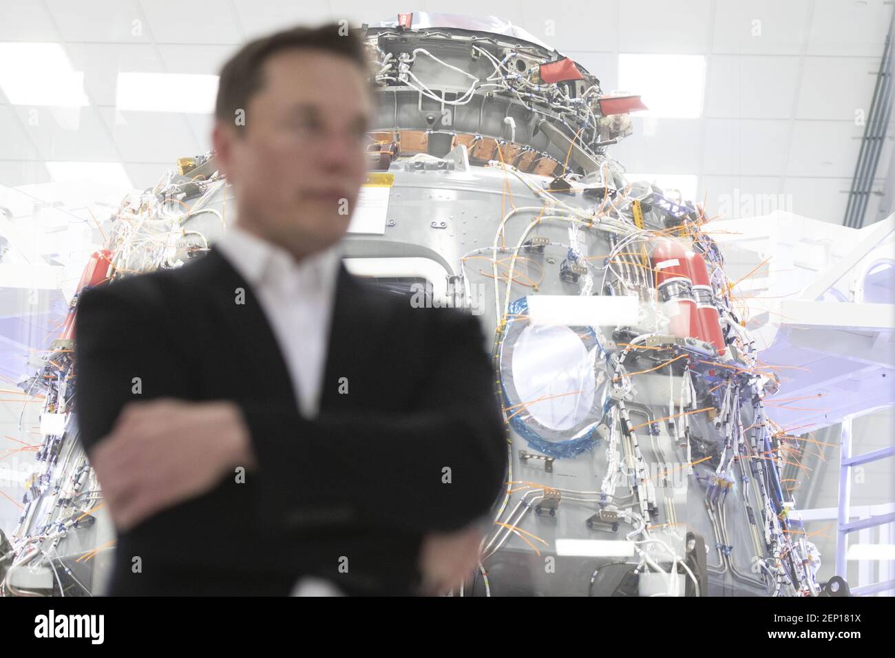 SpaceX Chief Engineer Elon Musk speaks to media in front of Crew Dragon ...