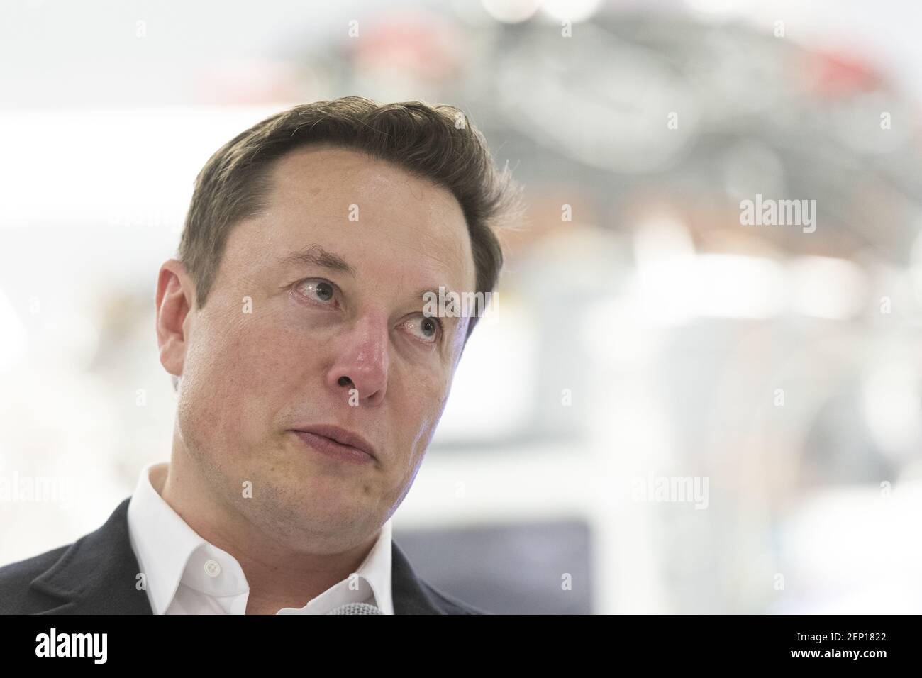 SpaceX Chief Engineer Elon Musk speaks to media in front of Crew Dragon ...