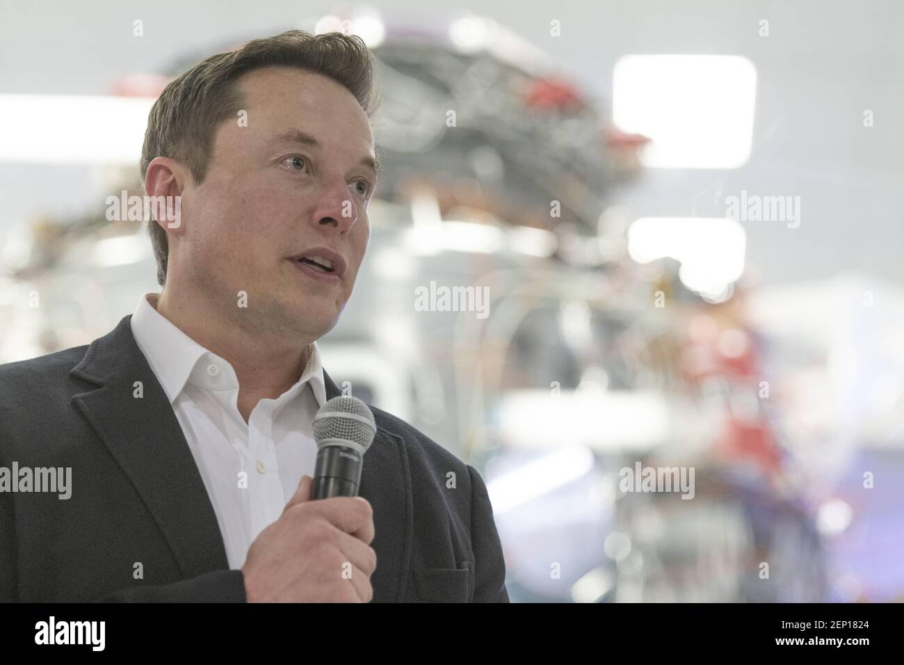 SpaceX Chief Engineer Elon Musk speaks to media in front of Crew Dragon ...