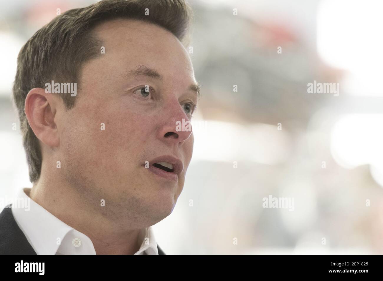 SpaceX Chief Engineer Elon Musk speaks to media in front of Crew Dragon ...