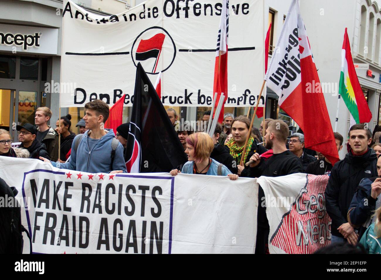 Protesters hold banners and flags during the demonstration. After the ...