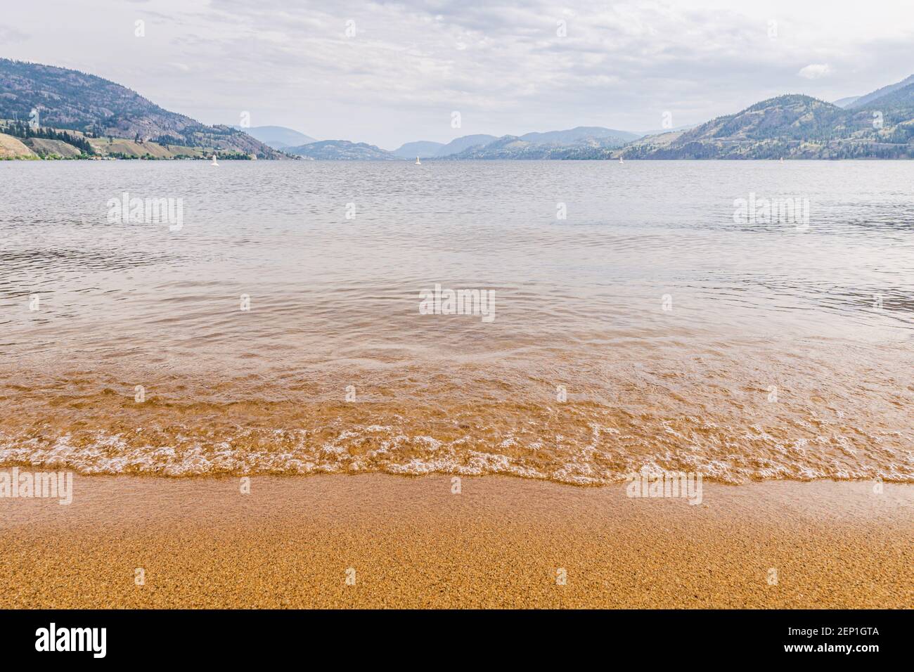 beautiful quiet morning on the lake beach with yellow sand Stock Photo ...