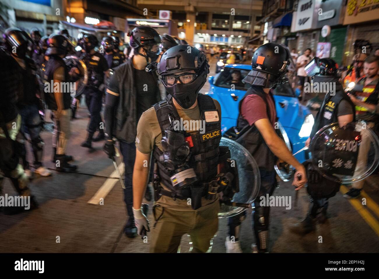 Hong Kong riot police disperse pro-democracy protesters in front of ...