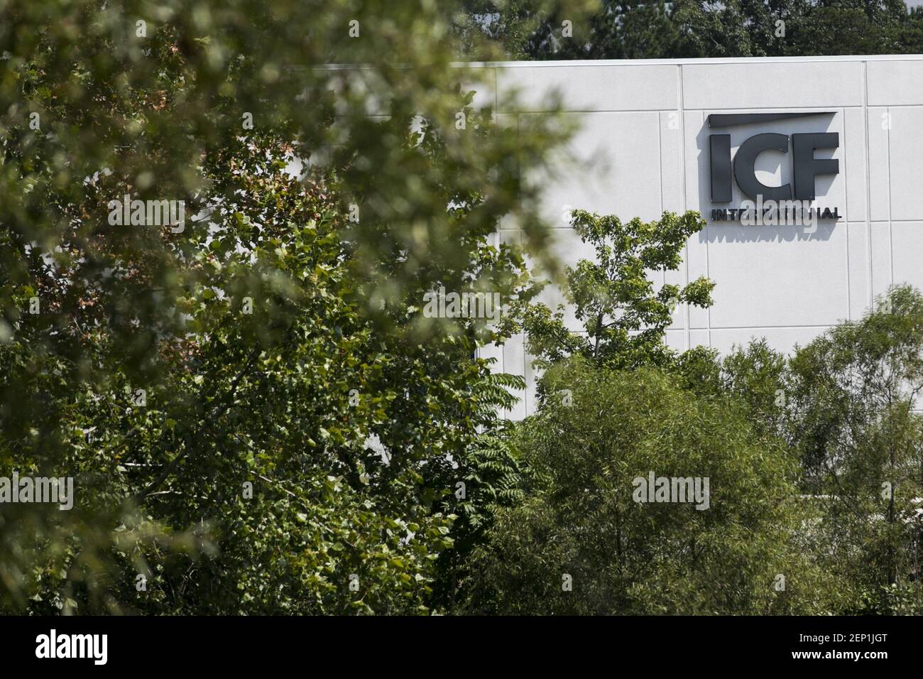 A logo sign outside of a facility occupied by ICF International in ...