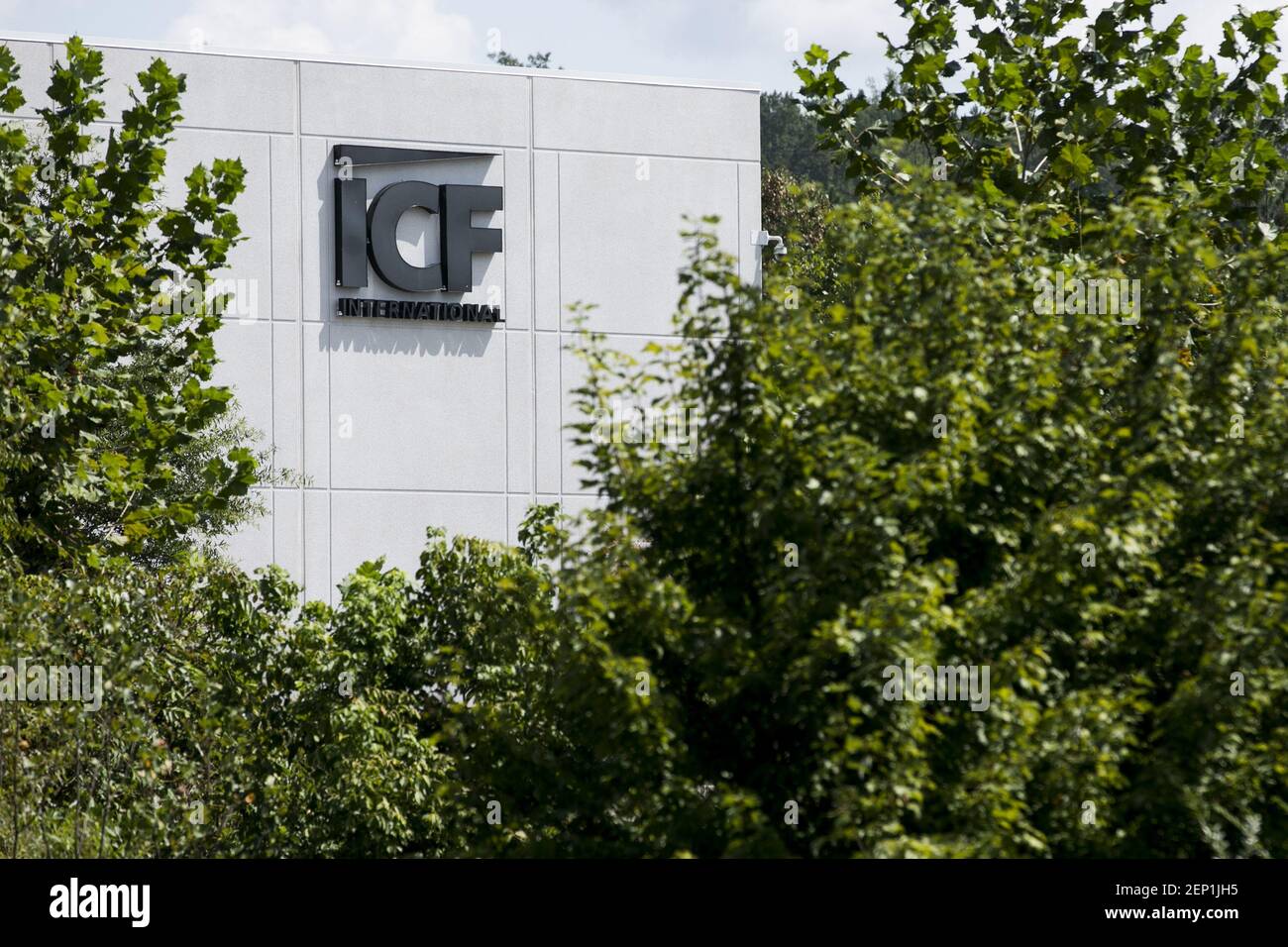 A logo sign outside of a facility occupied by ICF International in ...
