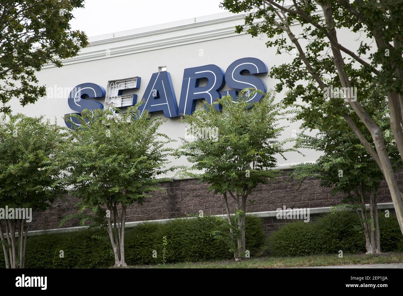 A logo sign outside of a closed Sears retail store location in Glen ...