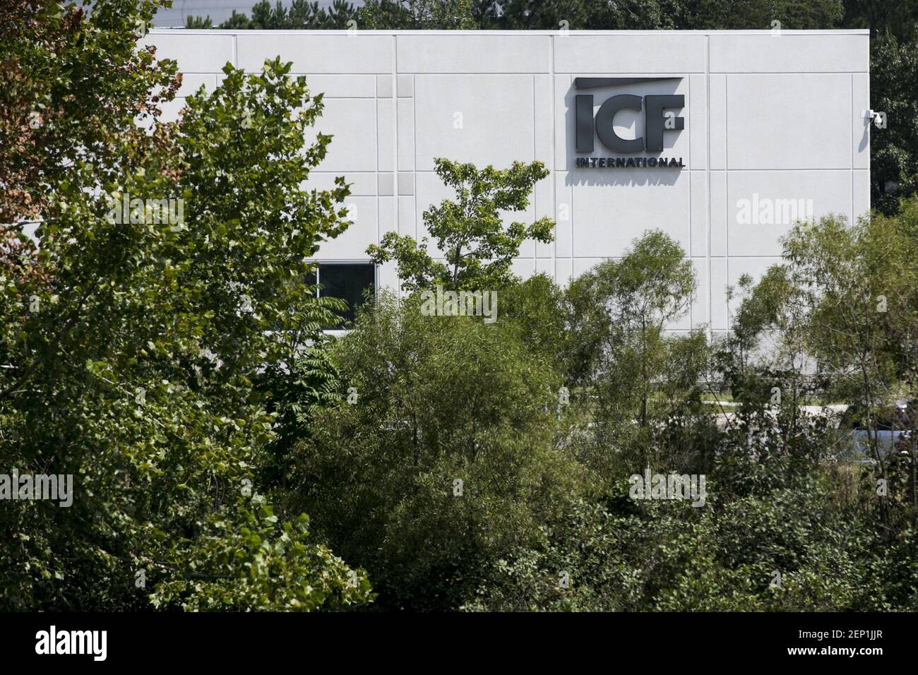 A logo sign outside of a facility occupied by ICF International in ...