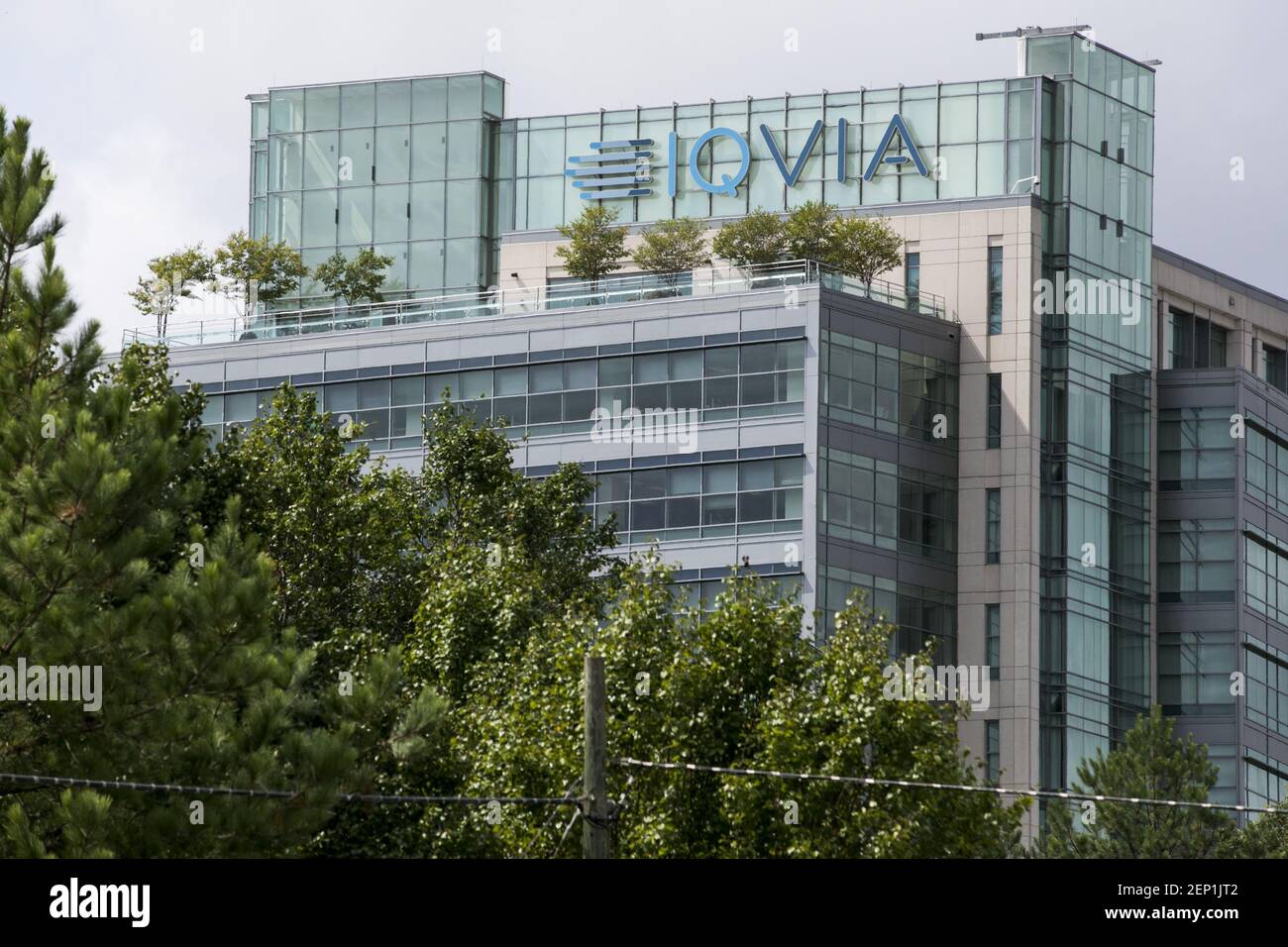 A logo sign outside of the headquarters of IQVIA in Durham, North ...
