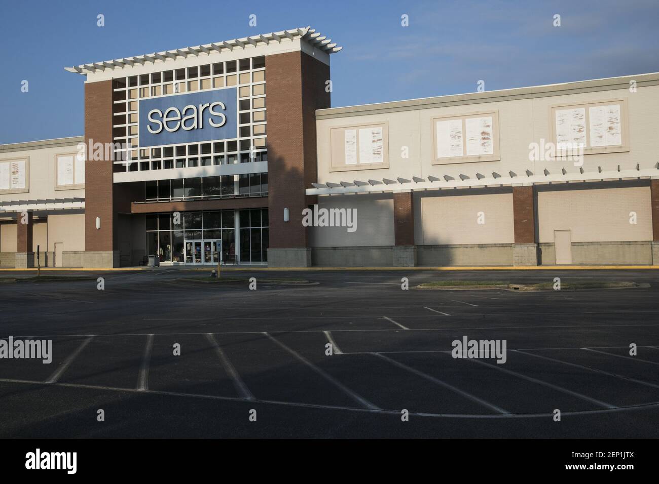 A logo sign outside of a Sears retail store location in Greensboro ...