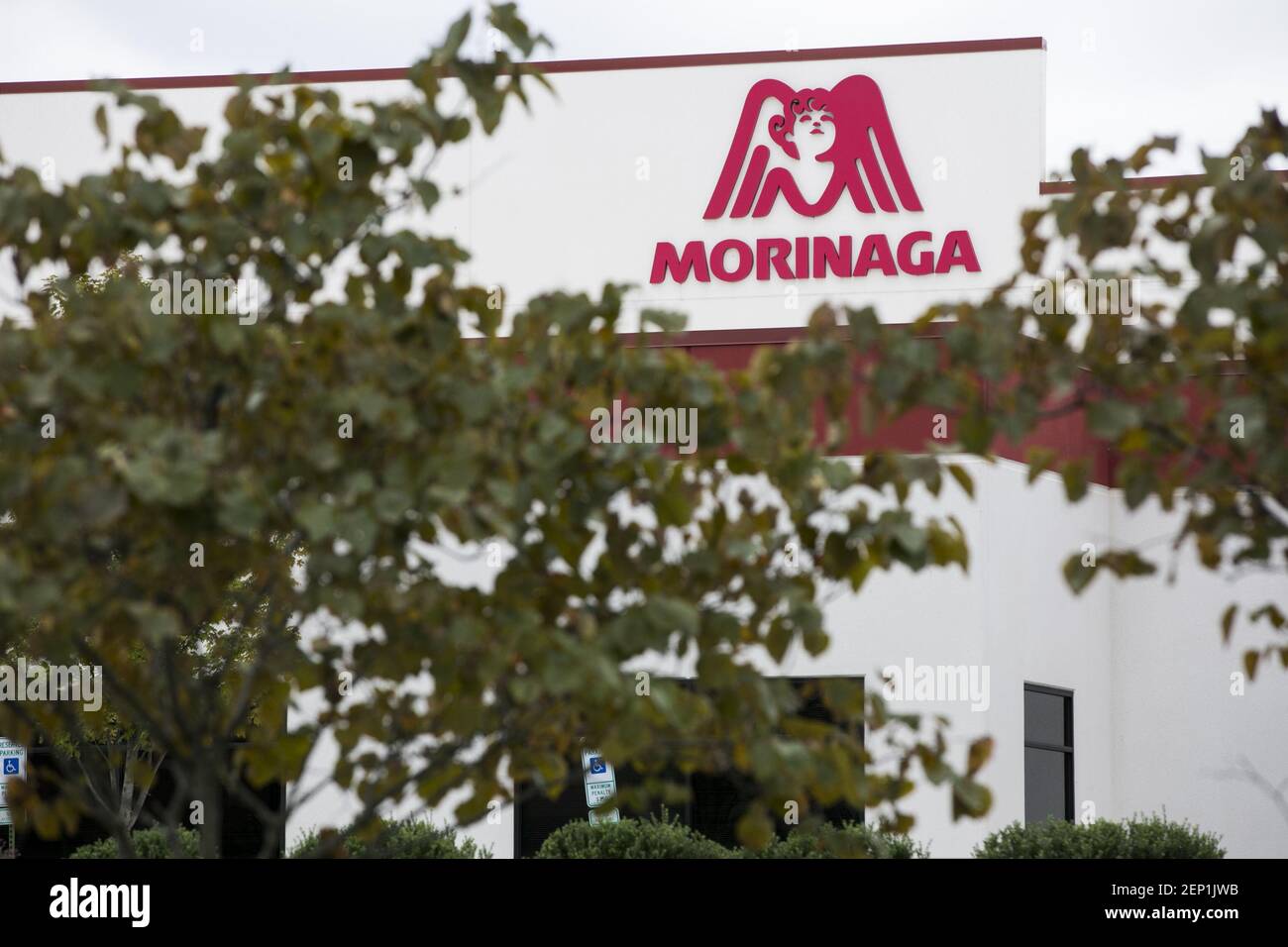 A logo sign outside of a facility occupied by Morinaga & Company in ...