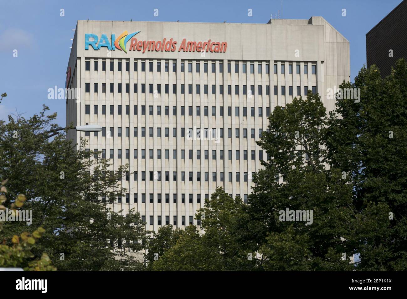 A logo sign outside of the headquarters of Reynolds American, Inc ...