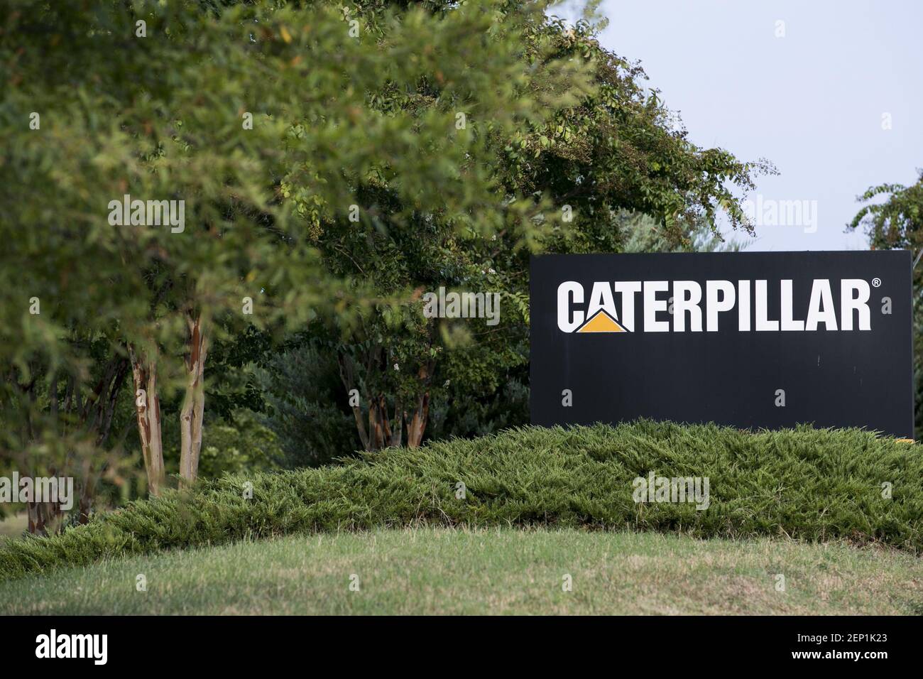 A logo sign outside of a facility occupied by Caterpillar, Inc., in ...