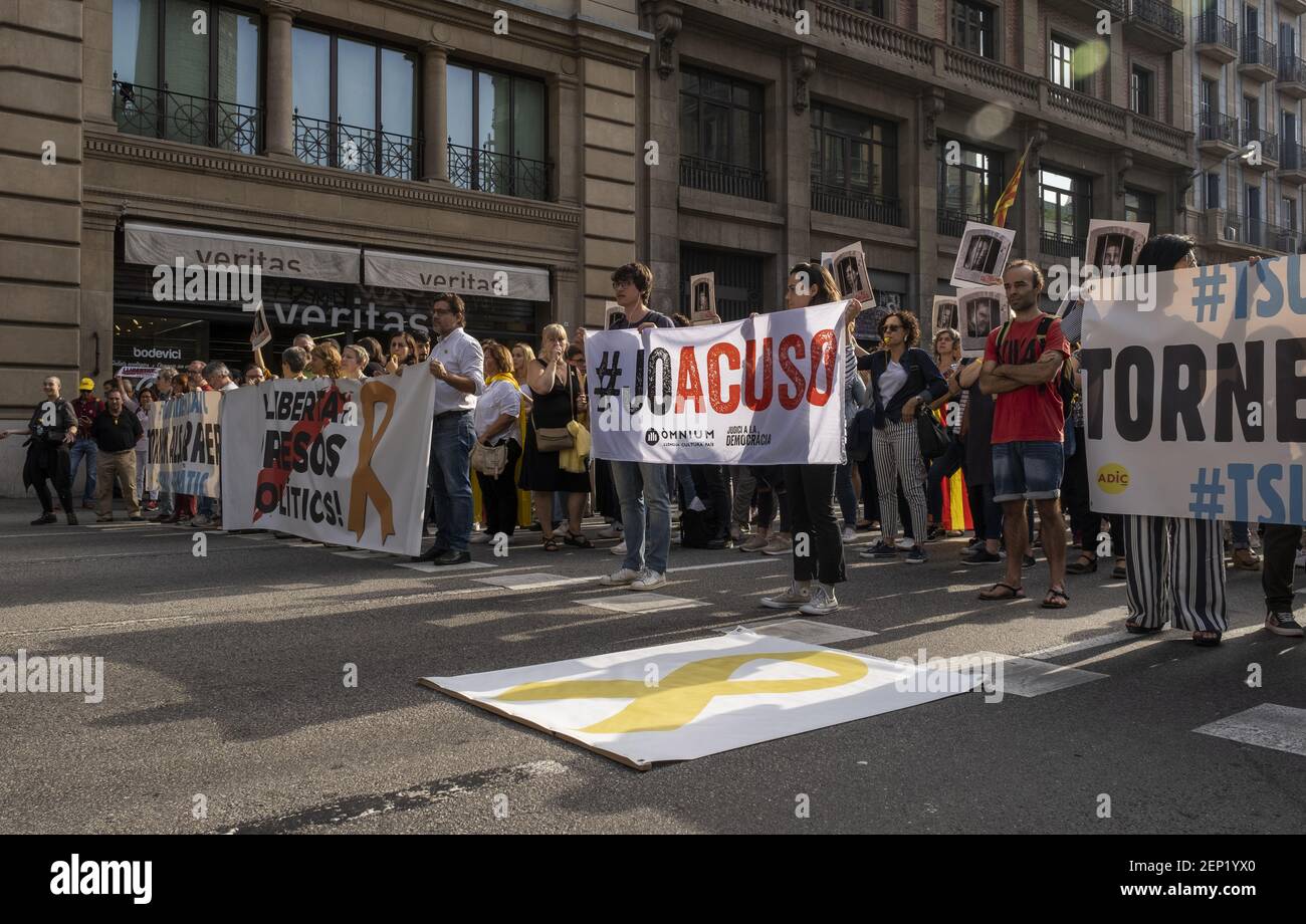 A group of protesters hold banners and placards during the ...
