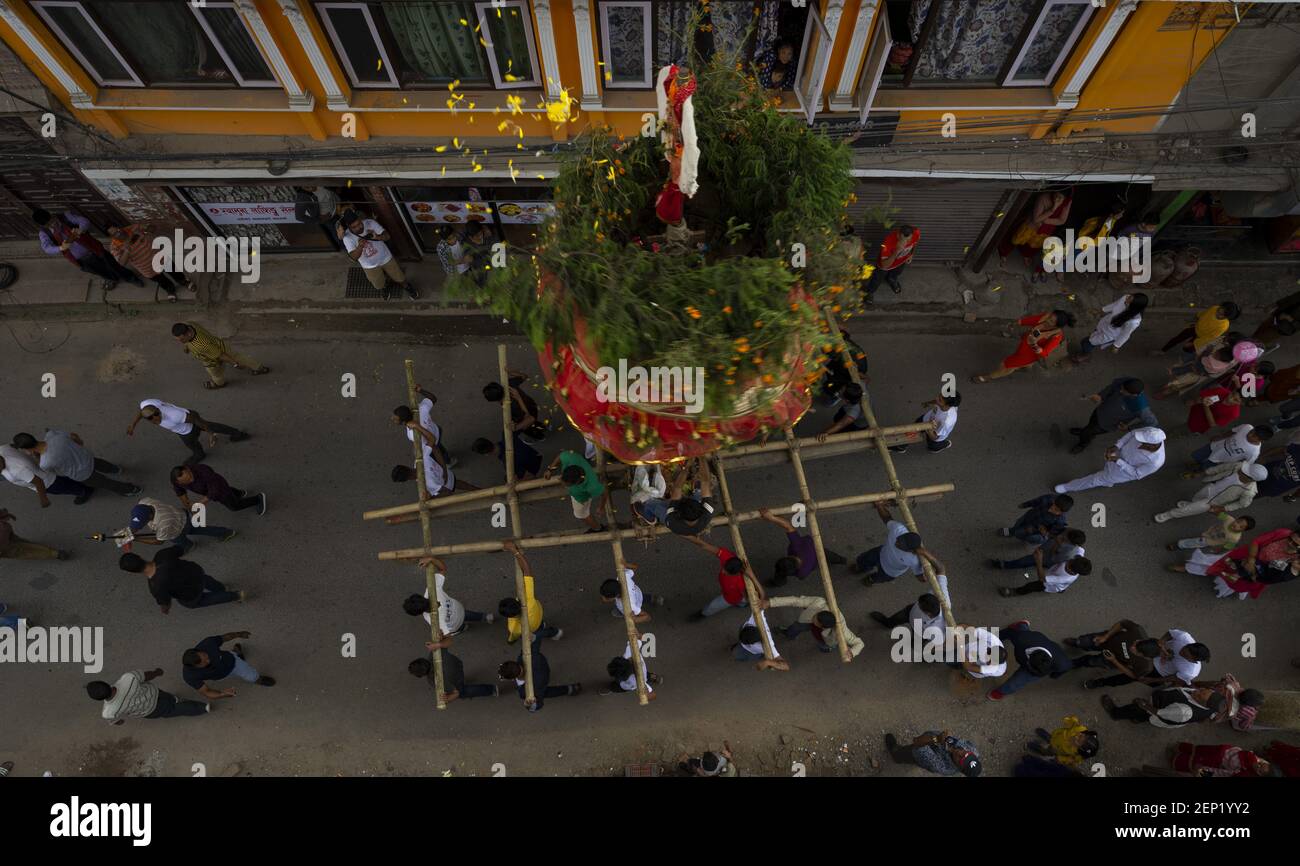 Devotees carry the chariot of Lord Narayan during the festival. The ...