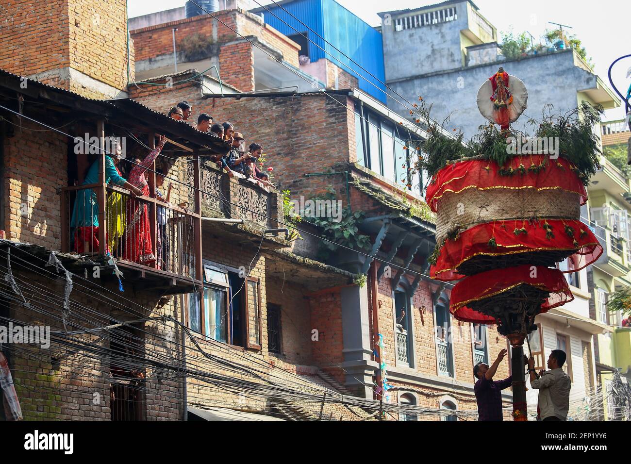 Devotees rotate the top part of a chariot of Lord Satya Narayan during ...