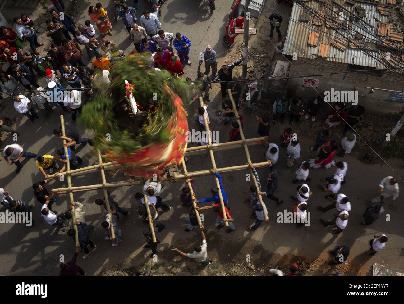 Devotees carry the chariot of Lord Narayan during the festival. The ...
