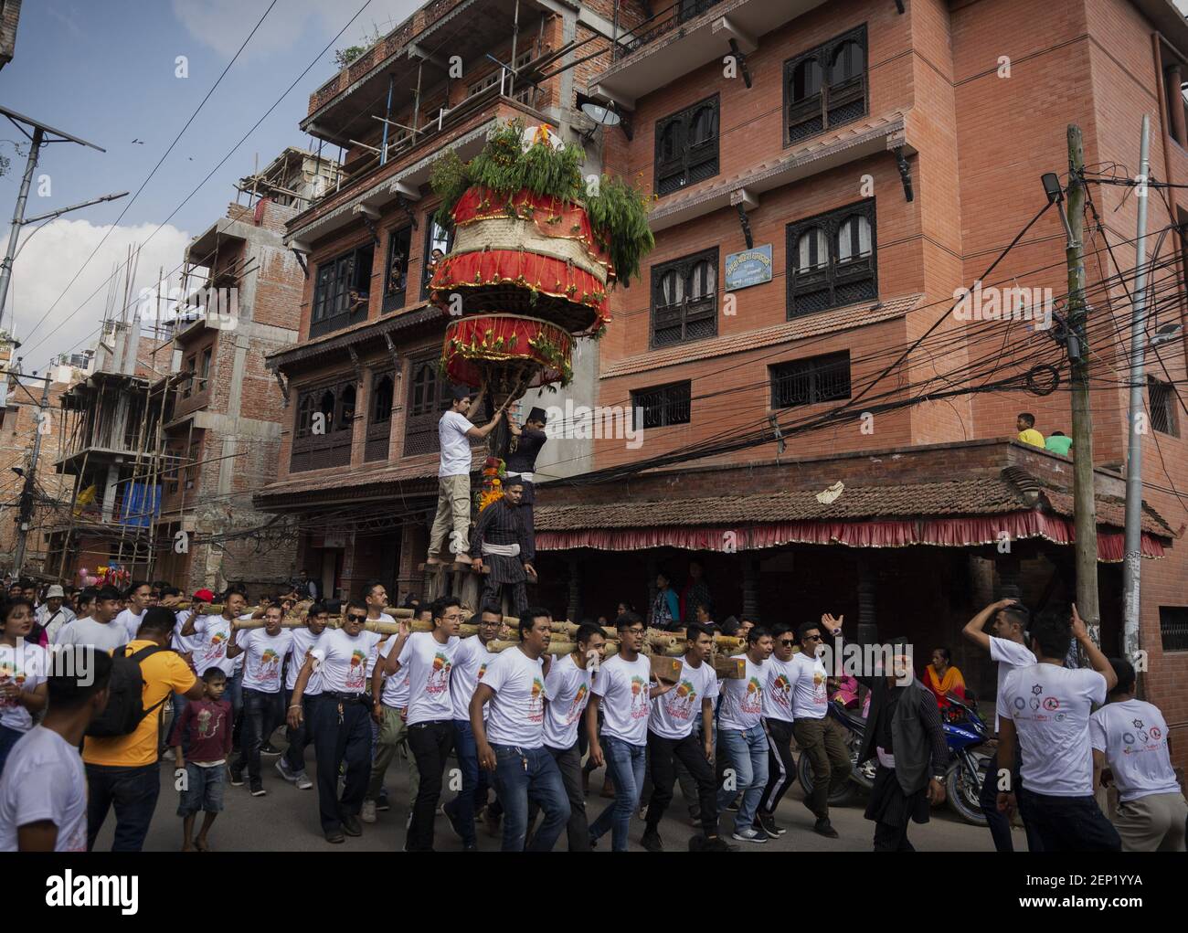 Locals carry the chariot of Lord Narayan during the festival. The ...