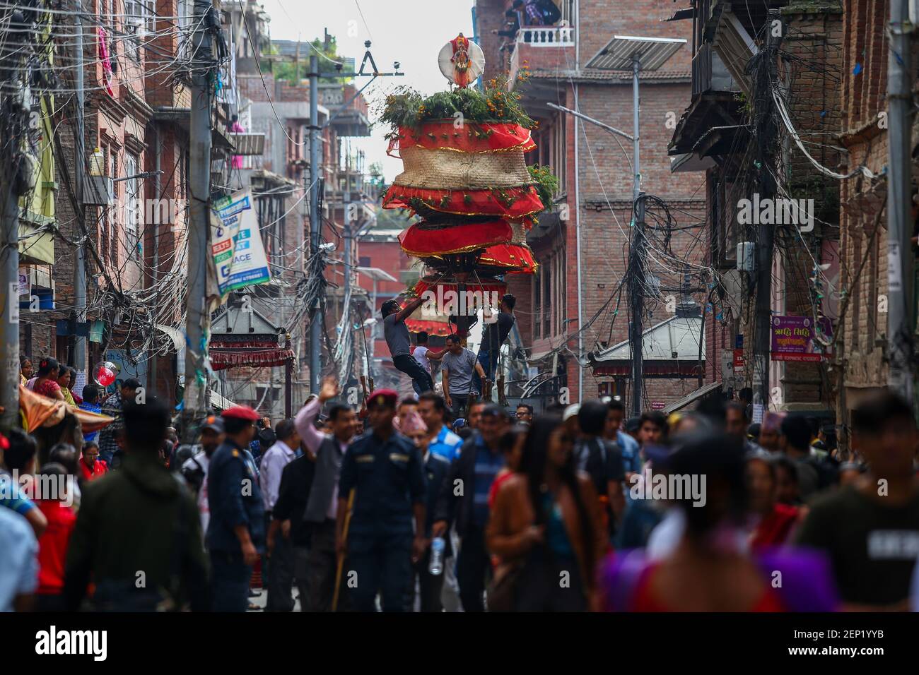 Nepalese devotees carry the chariot of Lord Satya Narayan during the ...
