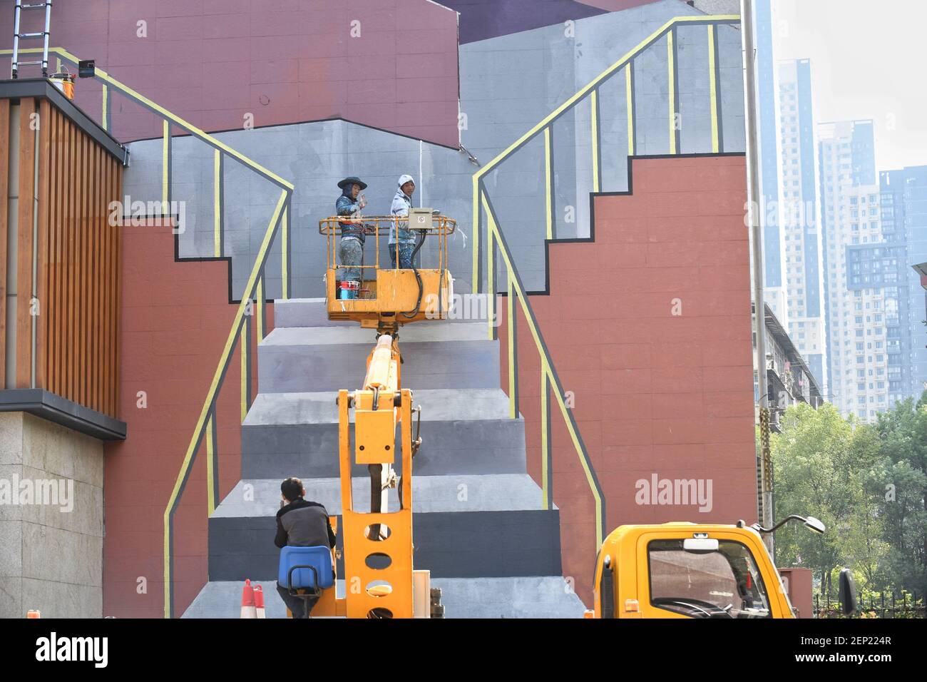 Artists draw the 60-meter-high mural, 14 meters higher than the ...