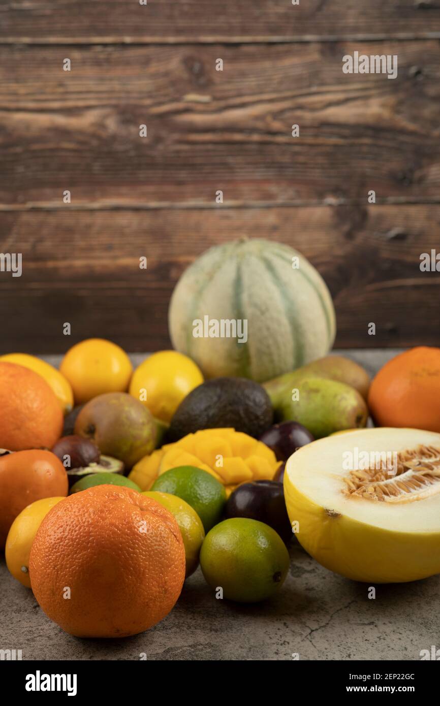 Pile of fresh whole fruit composition on marble surface Stock Photo - Alamy