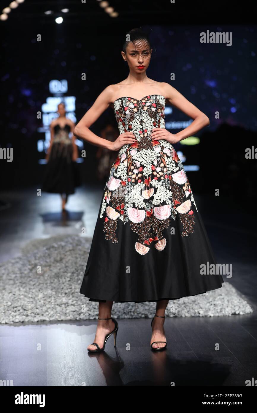 NEW DELHI, INDIA - OCTOBER 9: A model showcases a creation of fashion ...