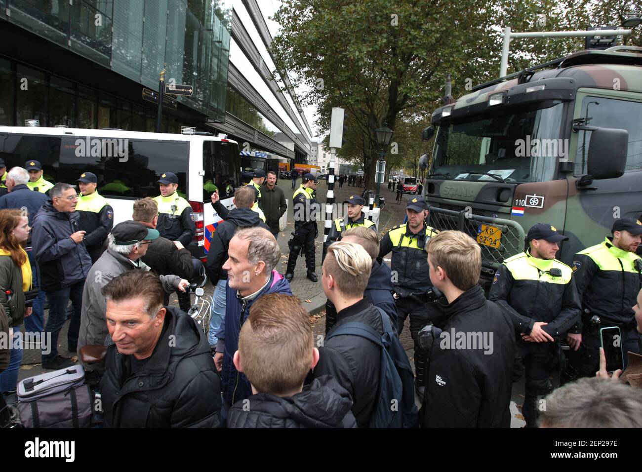 Dutch army trucks and anti-riot police block the road next the ...