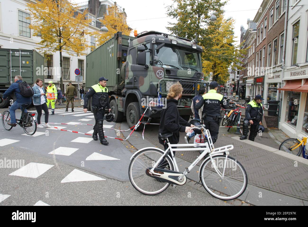 Dutch army trucks and anti-riot police block the road next the ...