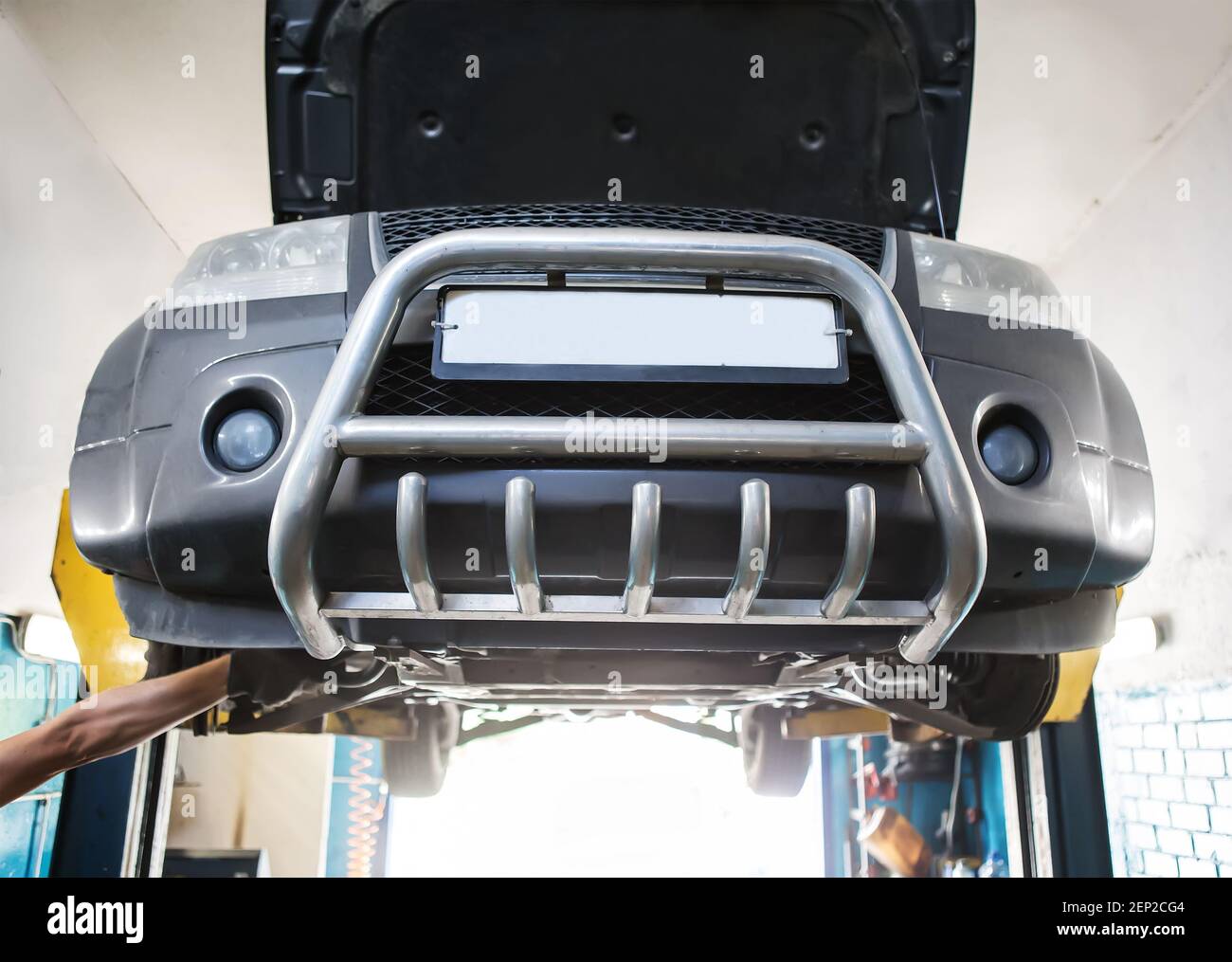 Professional mechanic lifting car engine hi-res stock photography and ...