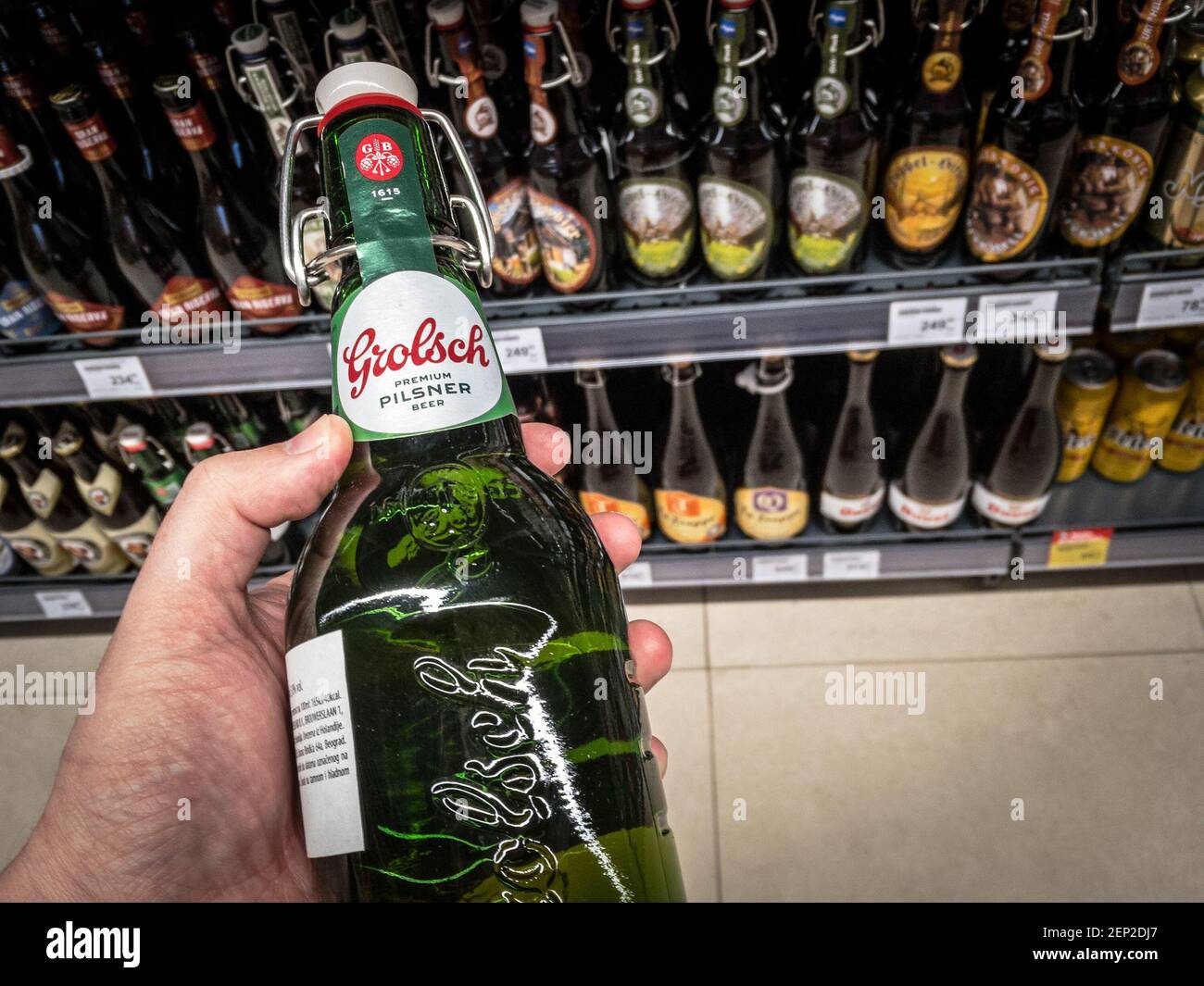 NOVI SAD, SERBIA - FEBRUARY 19, 2021: Grolsch logo on a light Pilsner ...