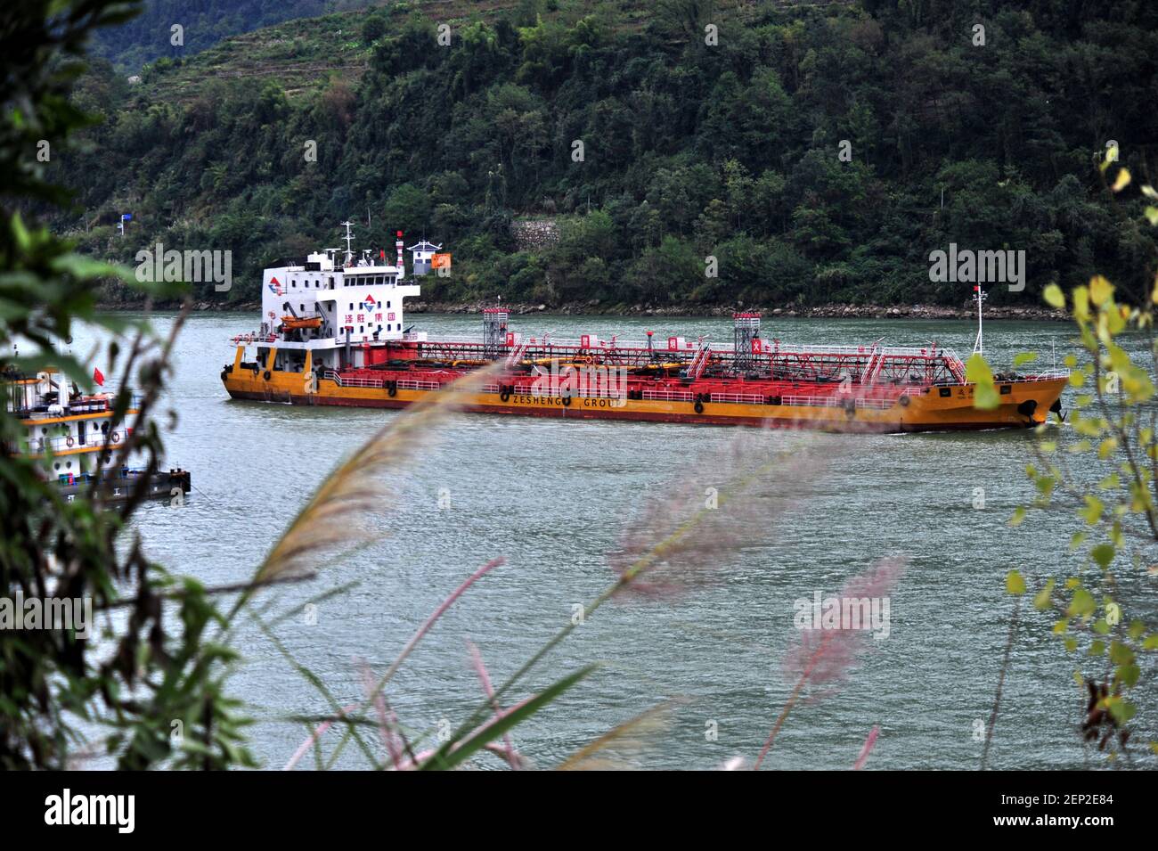Vessels travel on the Yangtze River at Yiling district of Yichang city ...