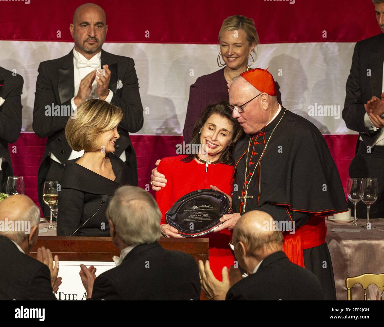 Mary Erdos, Amry Ann Tighe, Timothy Cardinal Dolan during award ...