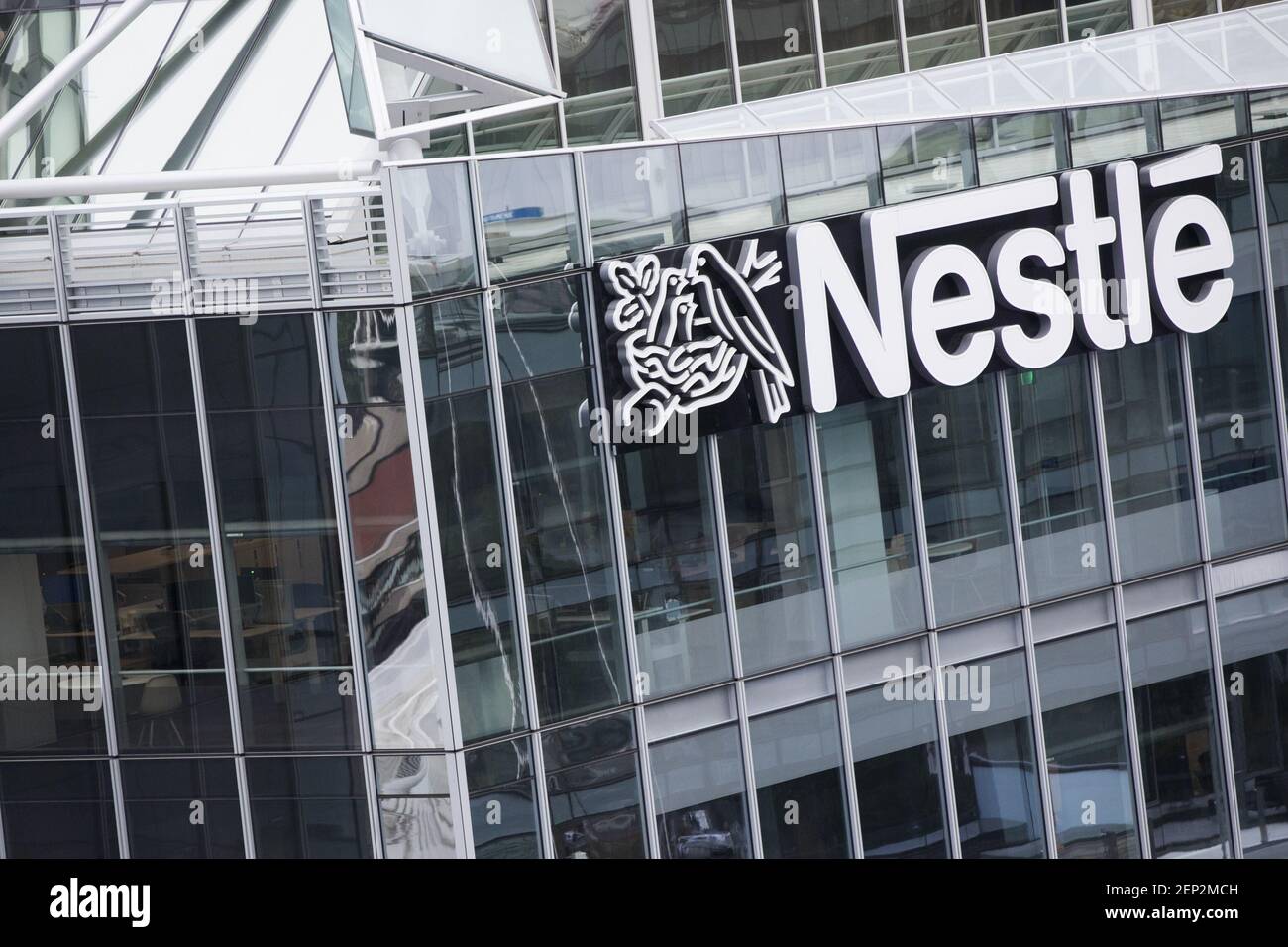 A logo sign outside of the headquarters of Nestle USA in Arlington ...