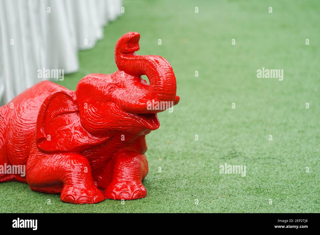 Asian Elephant statue figure sit and lay on the green turf Stock Photo ...