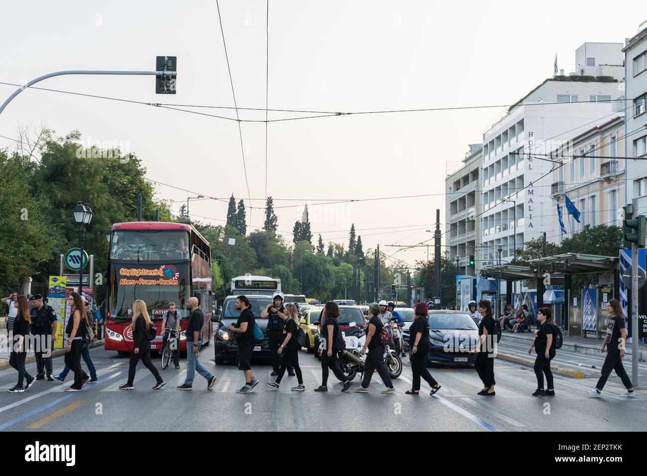Participants march through a main street during the parade. Walk for ...