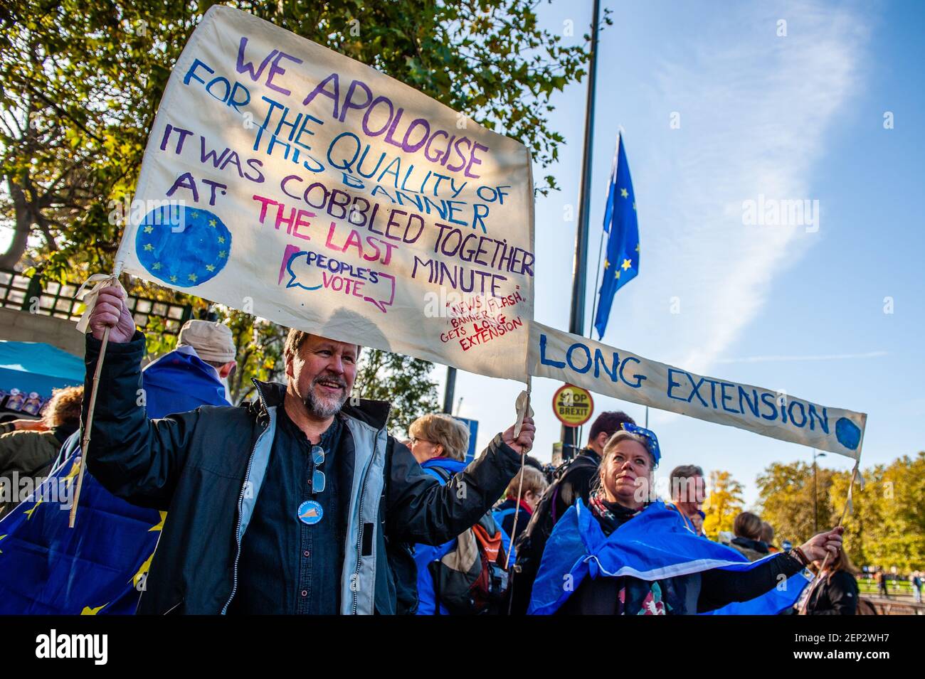 A couple holding a banner during the demonstration. A few days before ...
