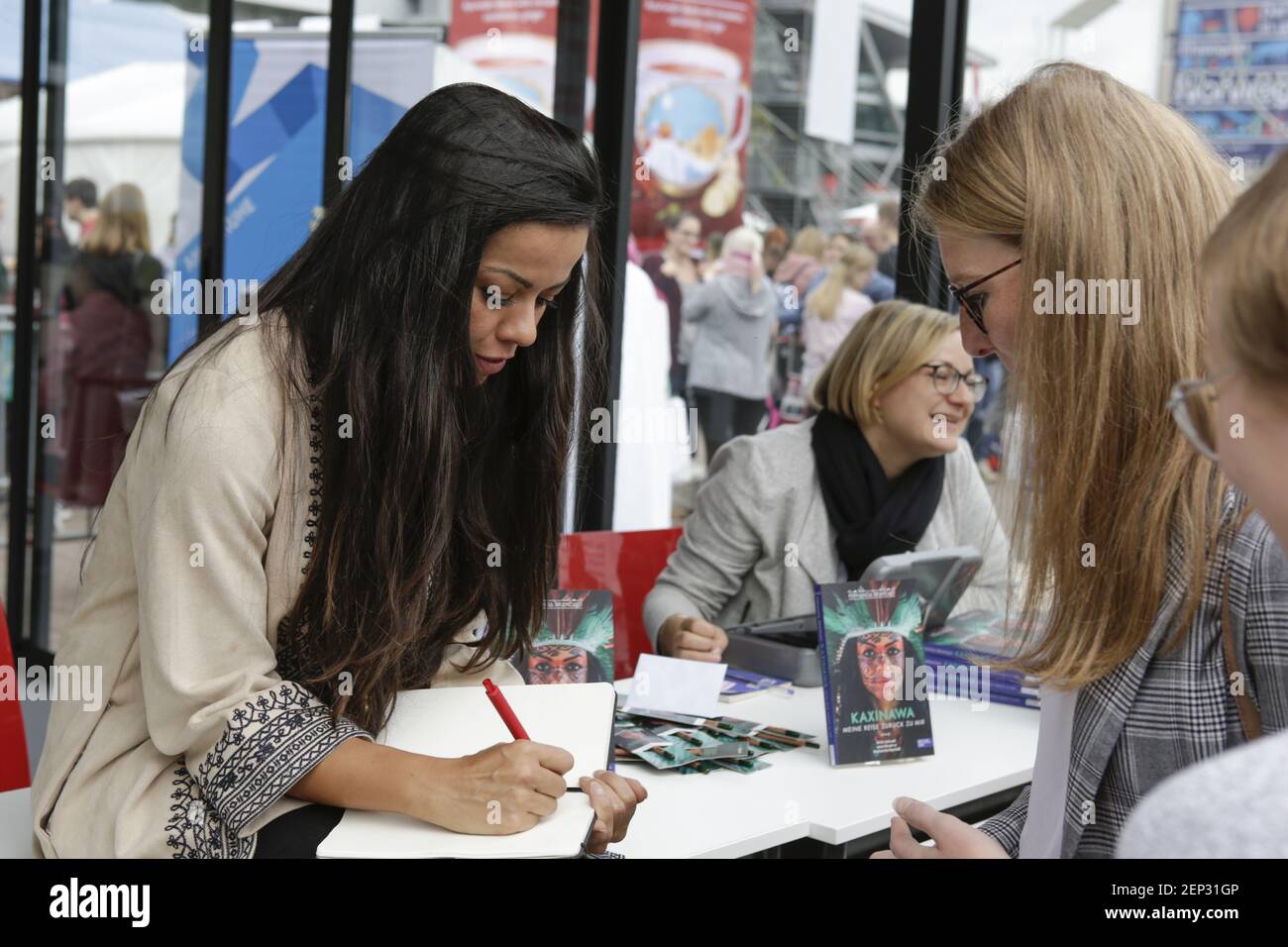 Brasilian-German singer Fernanda Brandão signs her book at the ...
