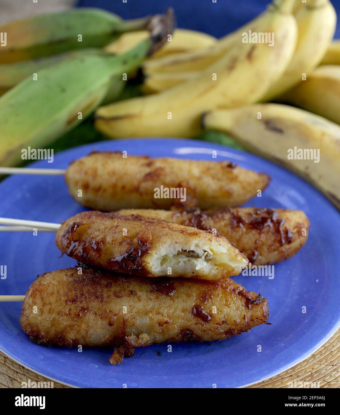 Fried banana with brown sugar, on a stick. (Photo by Hillary Levin/St ...