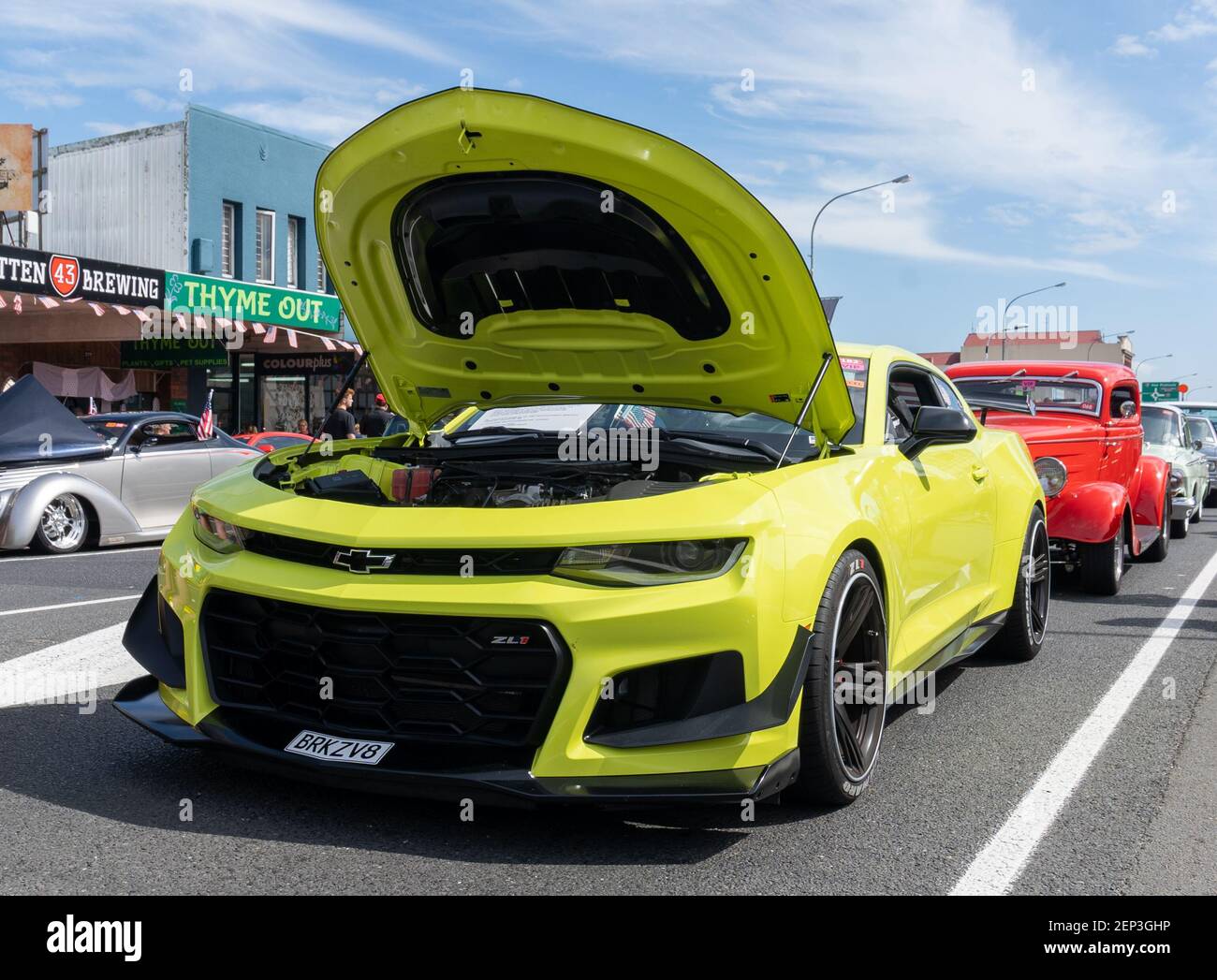 American classic and custom cars on display at an outdoor exhibition ...