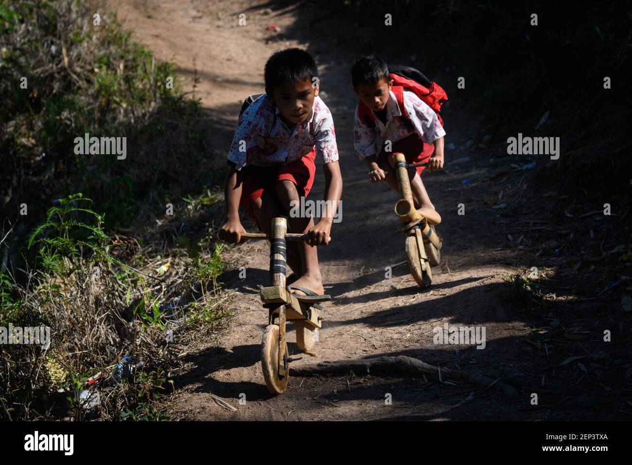 Asman and Marpil riding on their bamboo bikes. Kids in North Bastem ...