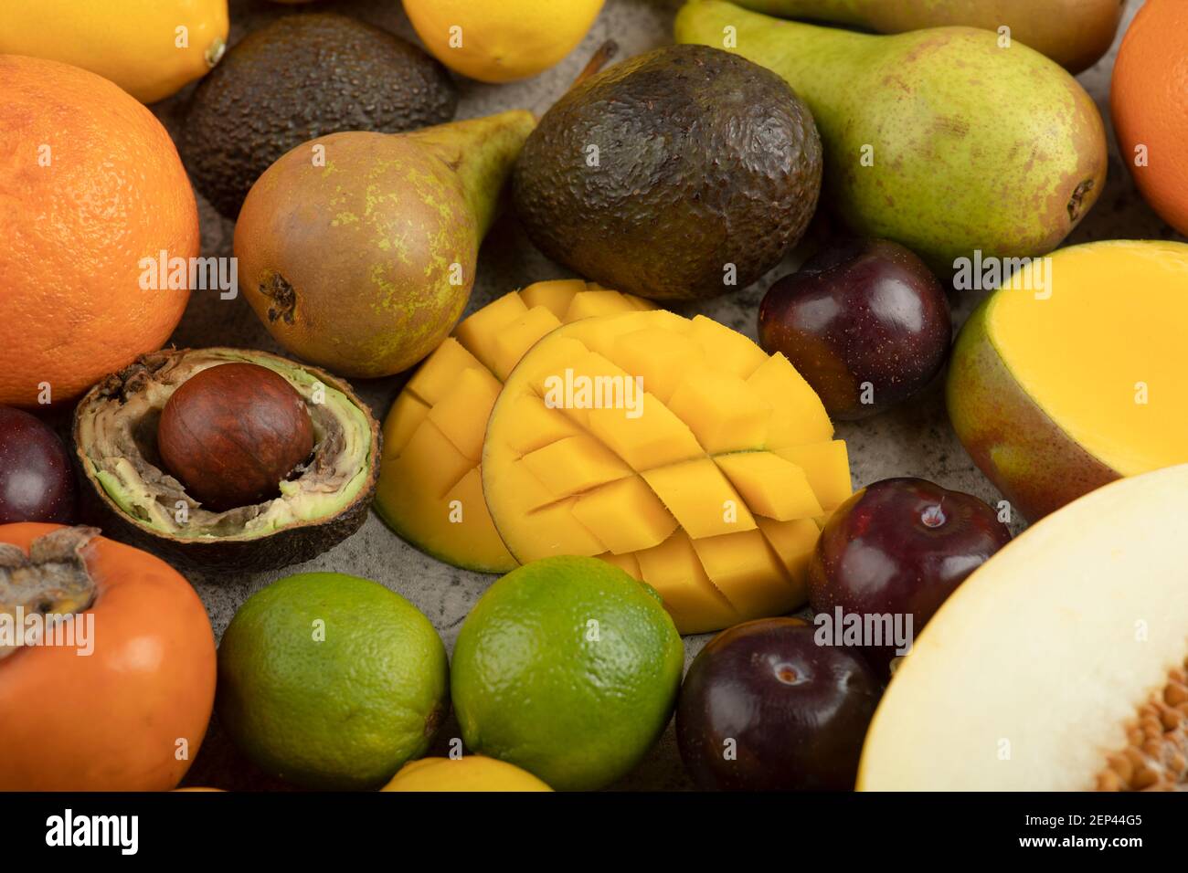 Pile of fresh whole fruit composition on marble surface Stock Photo - Alamy