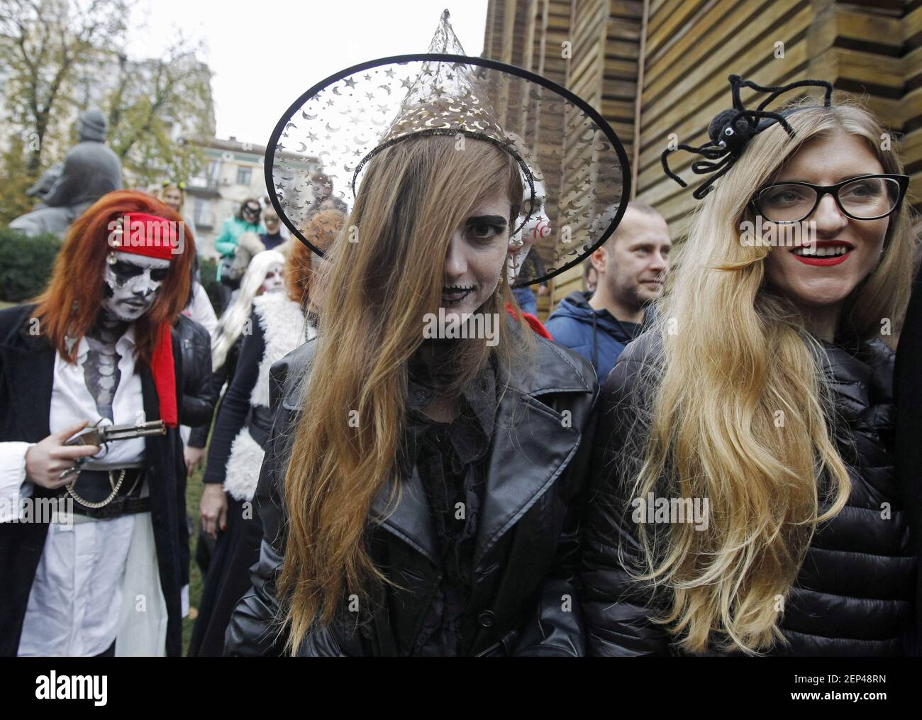 Participants wearing make-up and zombie costumes attend the Halloween ...