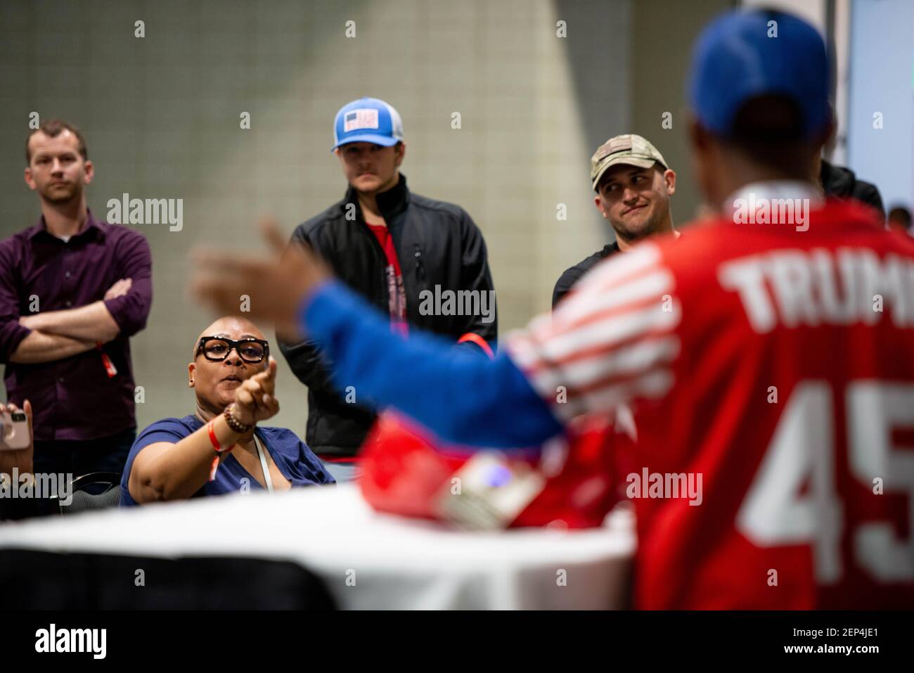 Audience members react during a live taping of the MAGA Network podcast ...
