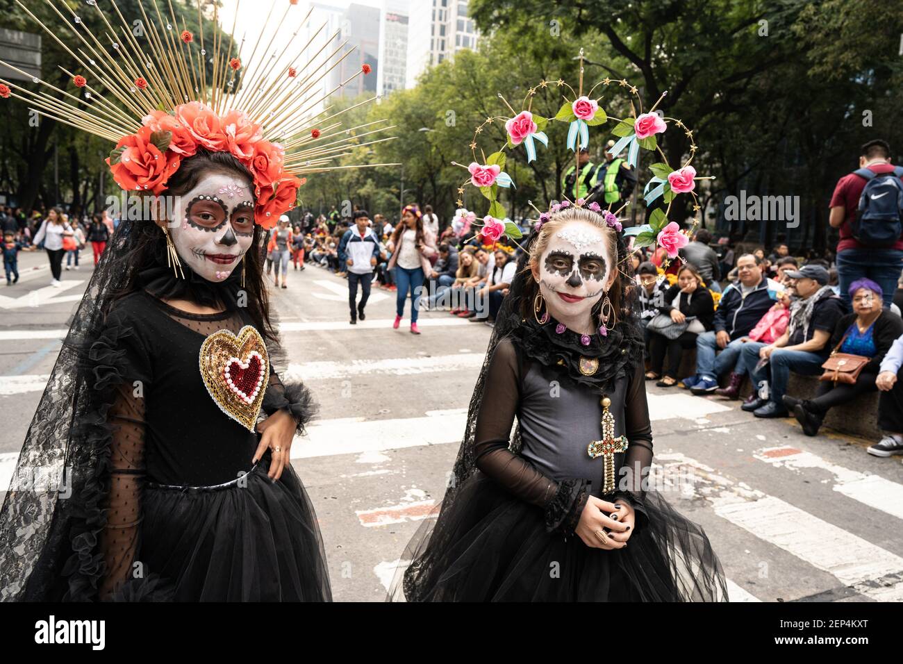 Two girls in costume seen during the Catrina Festival. Thousands of ...