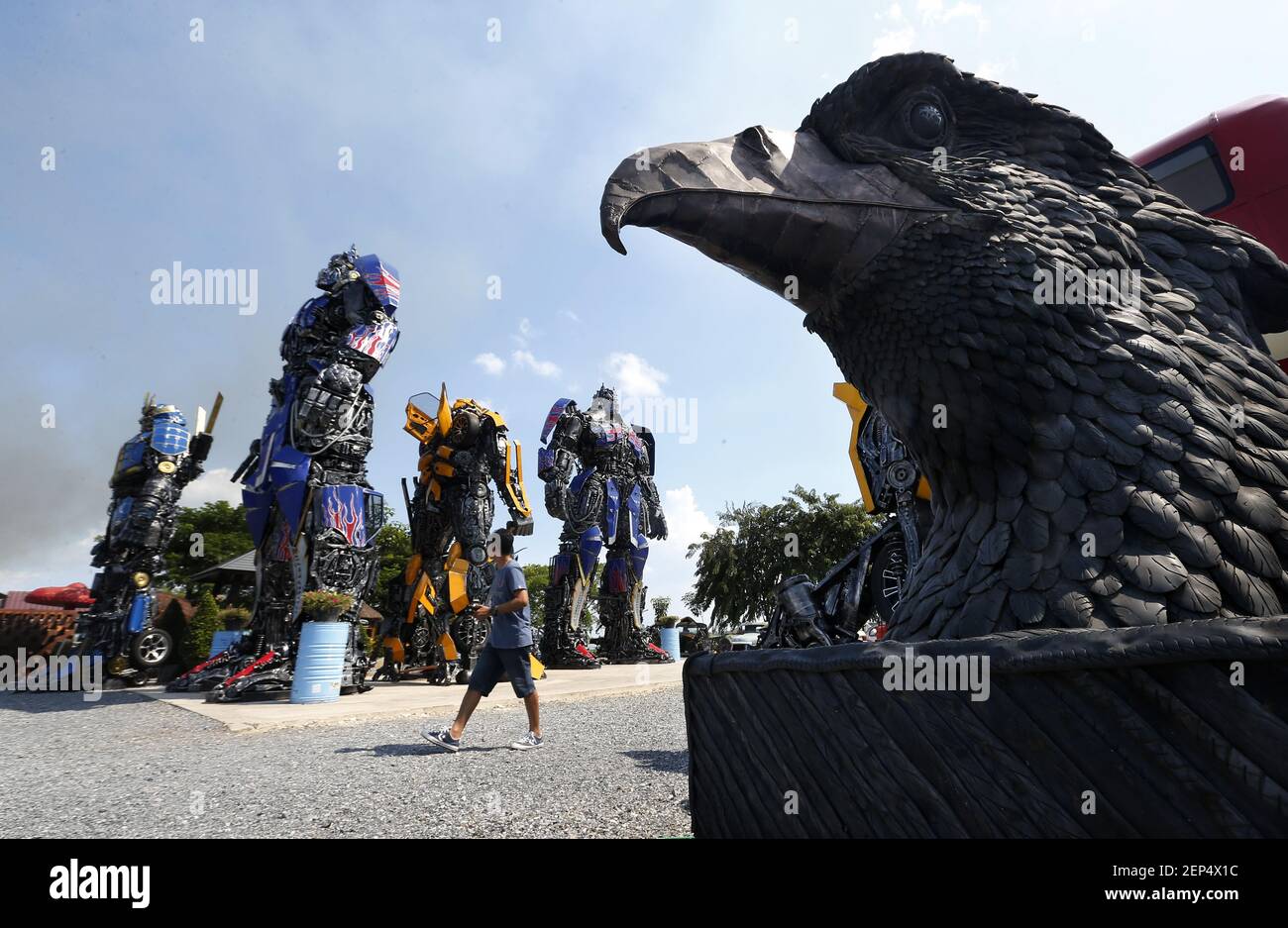 A man visits Ban Hun Lek, a metalwork shop renowned for giant statues ...