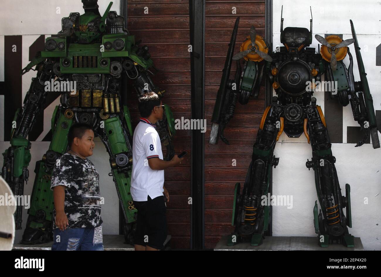 People visit Ban Hun Lek, a metalwork shop renowned for giant statues ...