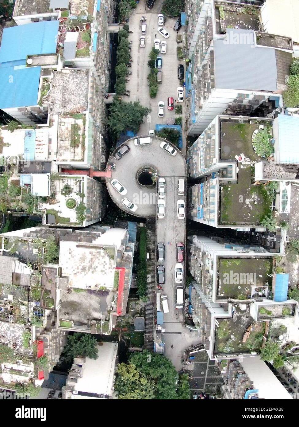 Aerial view of cars driving in the spiral parking lot in Chongqing ...