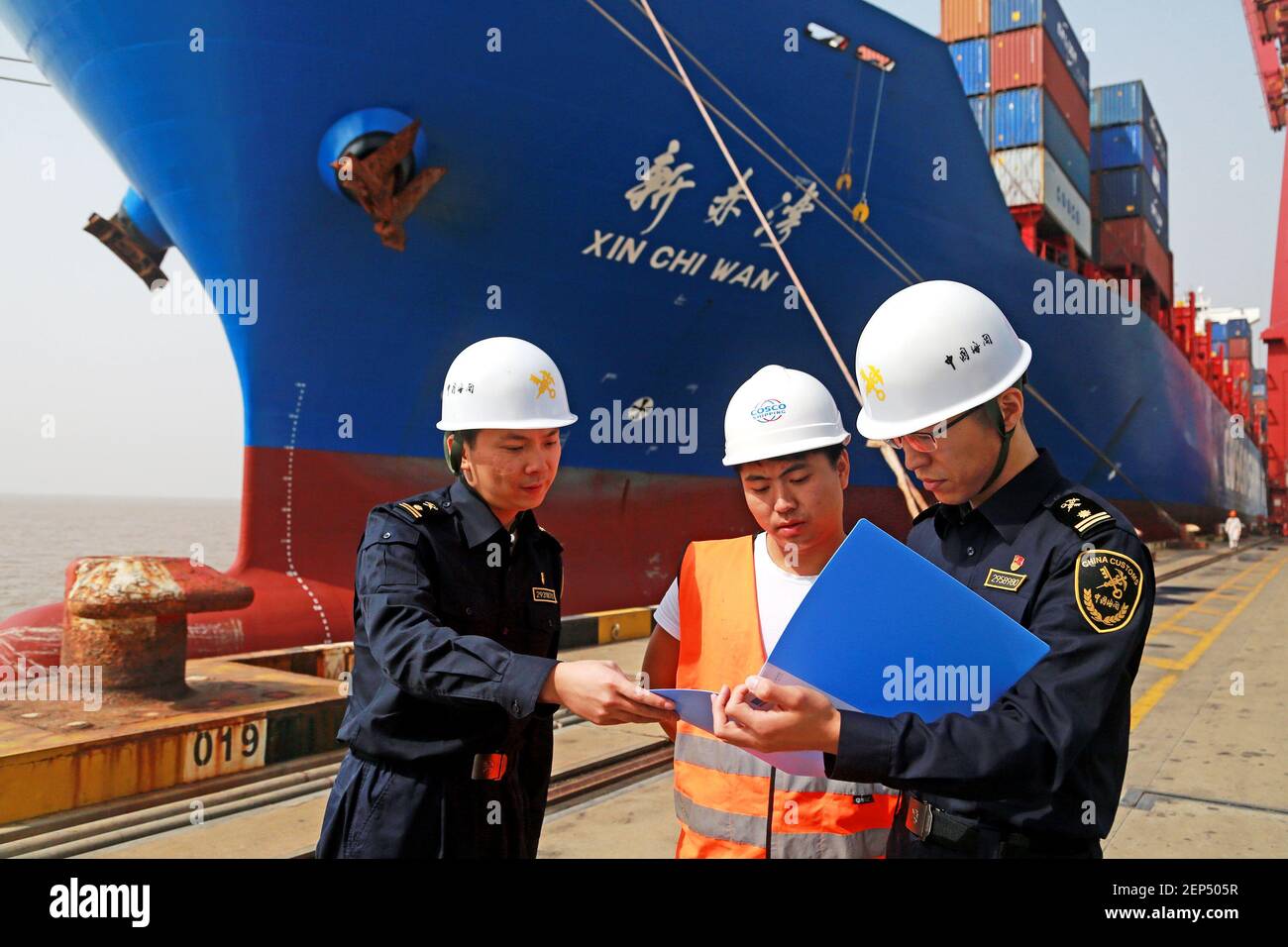 Custom officers check a vessel containing cargo from Australia at the ...