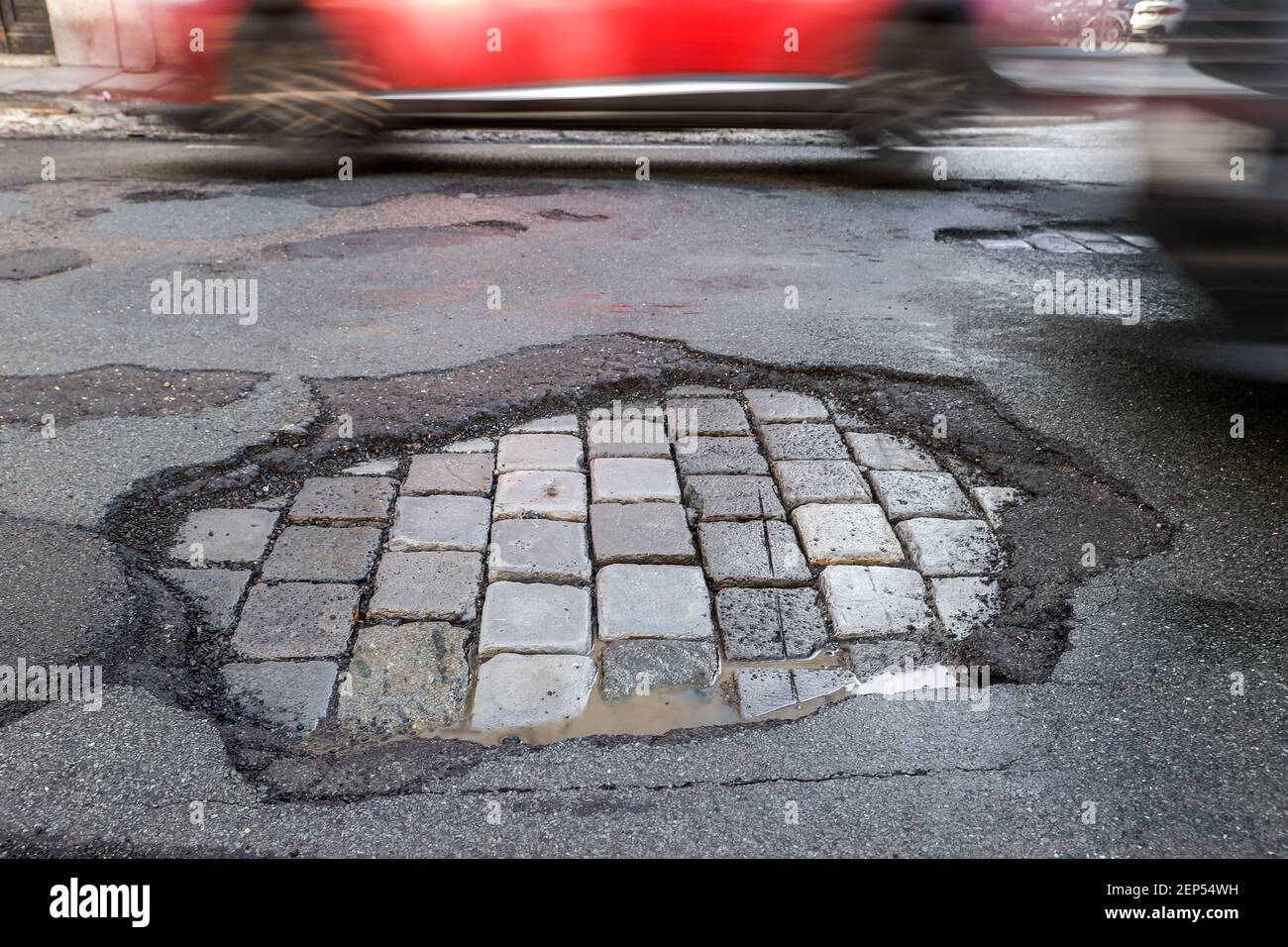 Cars over potholes hi-res stock photography and images - Alamy